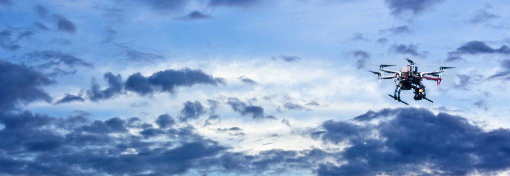 drone in the sky at sunset - dronegenuity